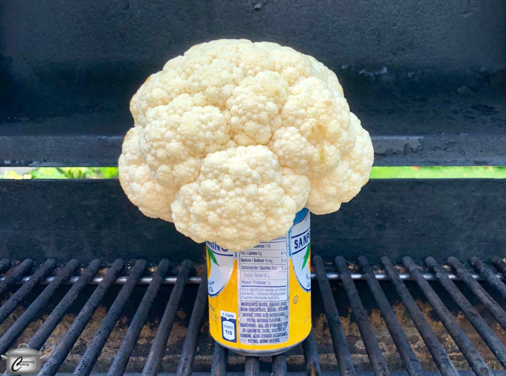 Grilled cauliflower on a can with sweet and spicy BBQ sauce ...